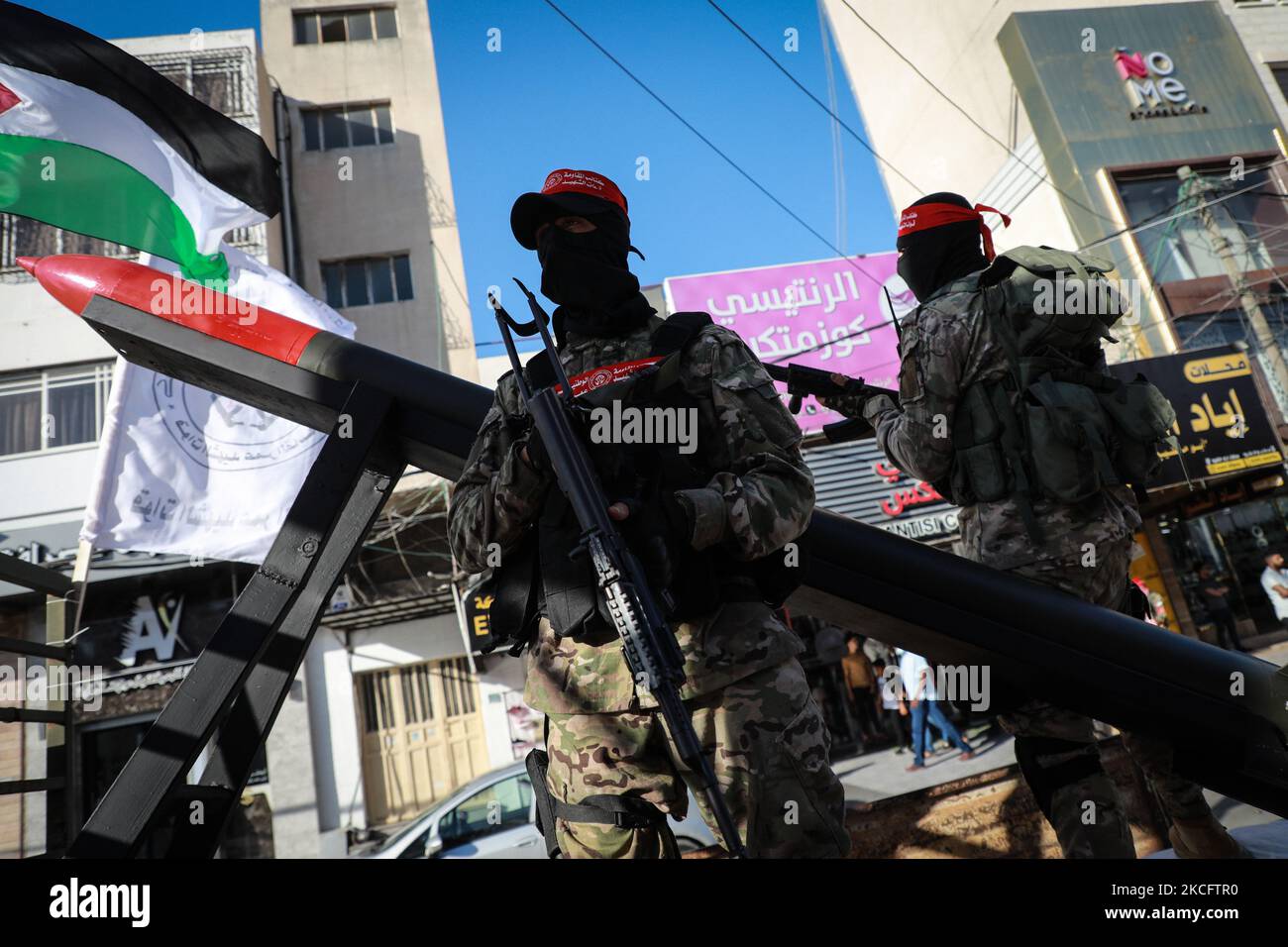 Masked fighters of the National Resistance Brigades, the military wing ...