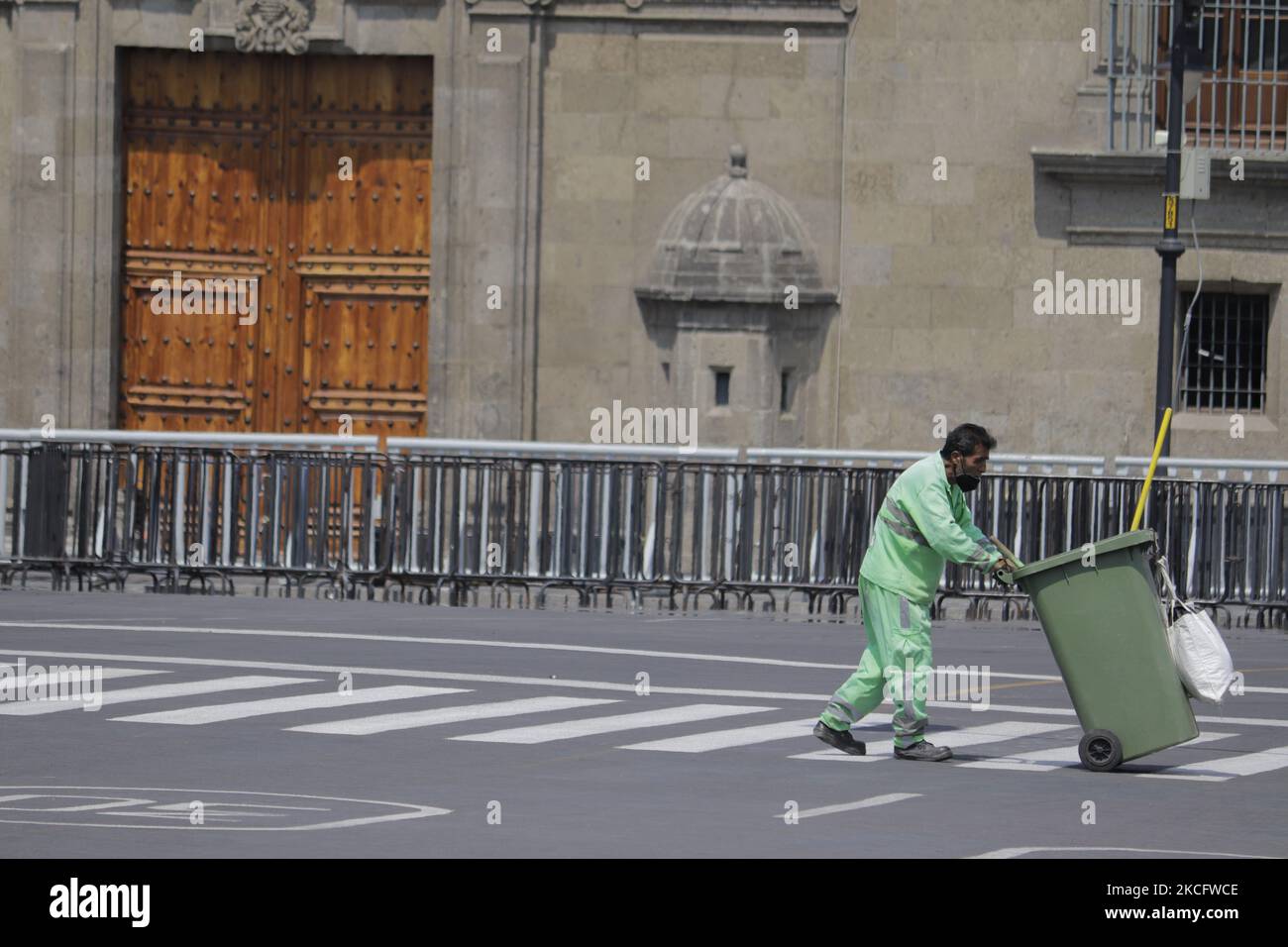 A clean-up worker in Mexico City's Zócalo during the COVID-19 health ...