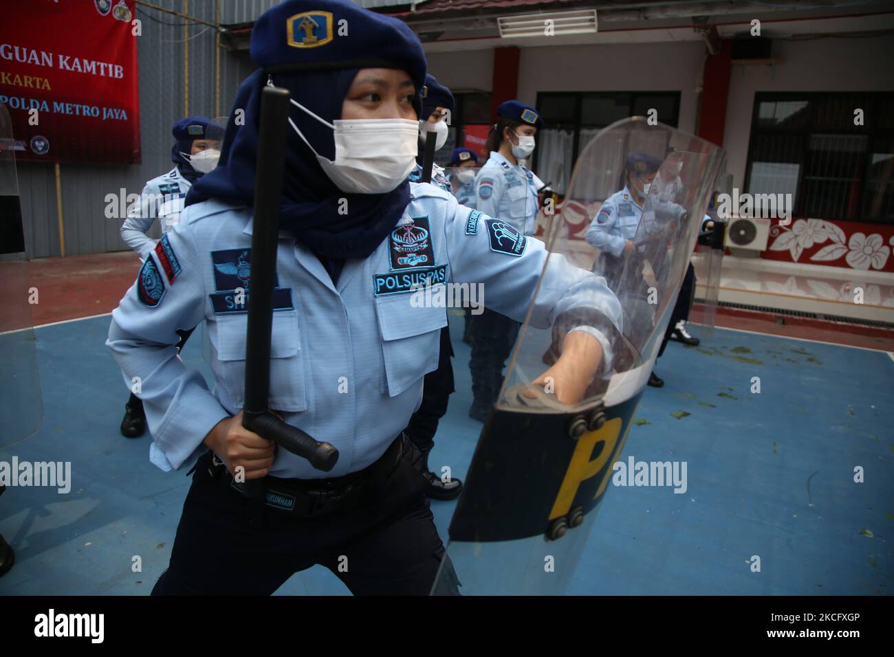 A number of female prison guards conduct training on simulation and ...