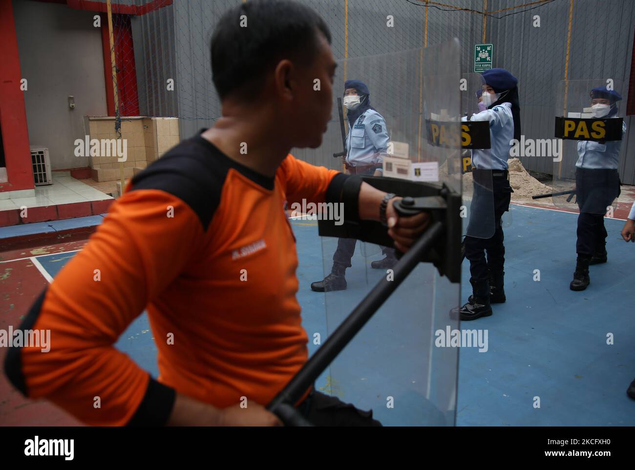 A number of female prison guards conduct training on simulation and ...