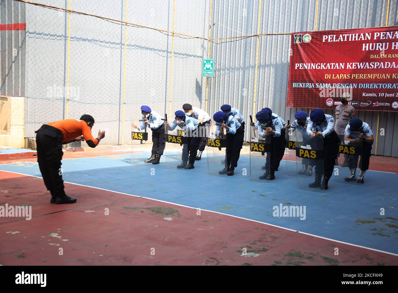 A number of female prison guards conduct training on simulation and ...