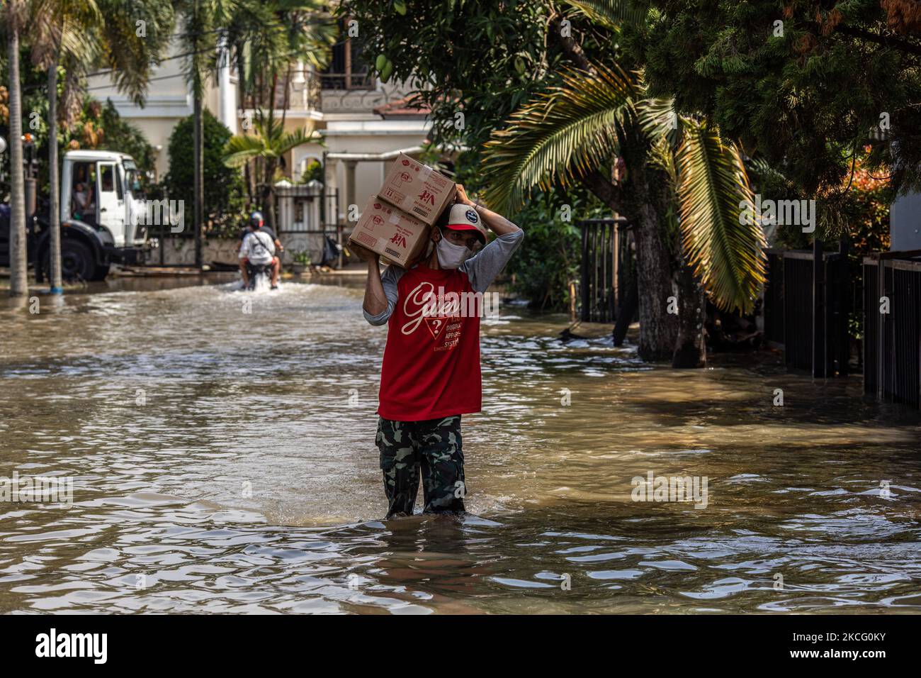 South Tangerang, Banten, Indonesia, 12 June 2021 :A resident brings ...