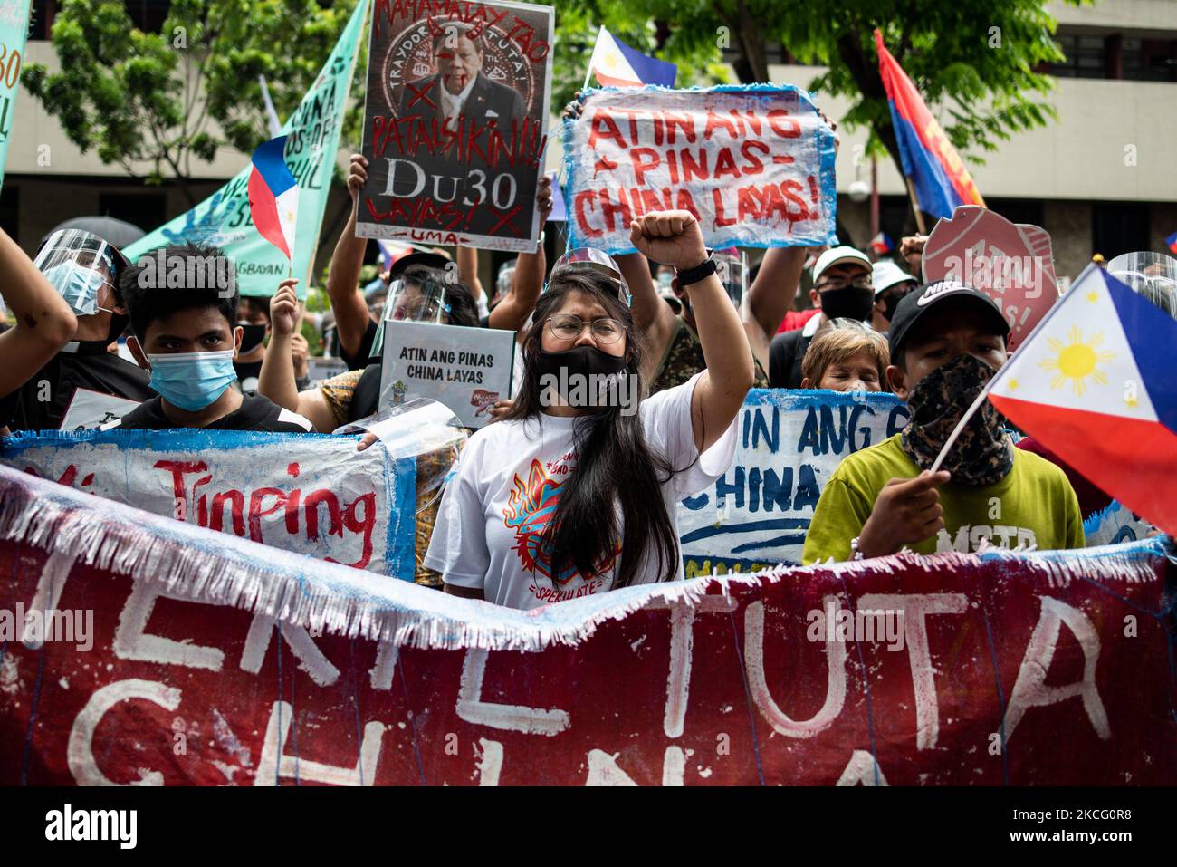 Protesters wearing face masks as protection against the COVID-19 gather ...