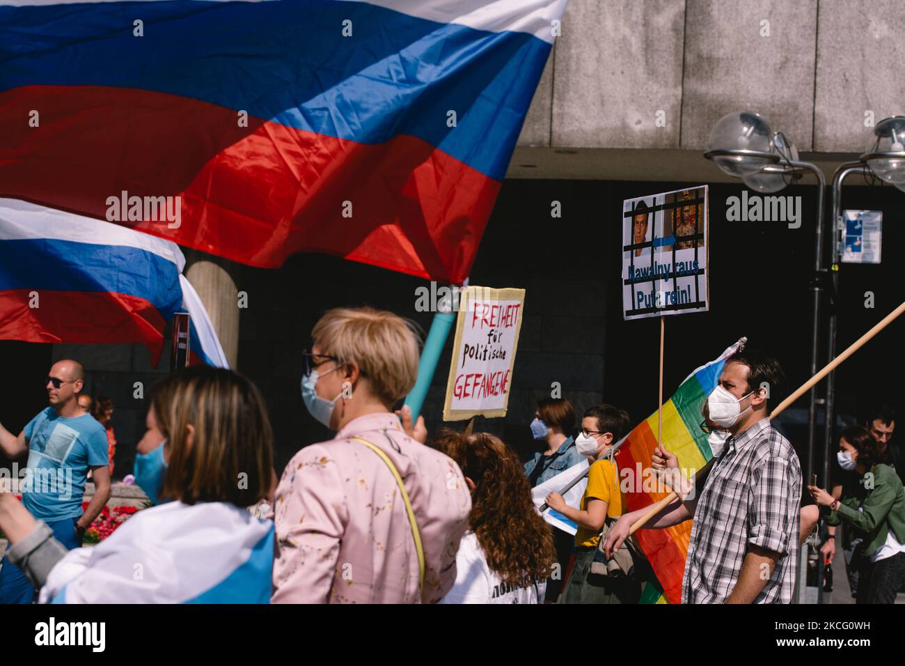 people attend an anti-kremlin rally in Cologne, Germany on June 12 ...