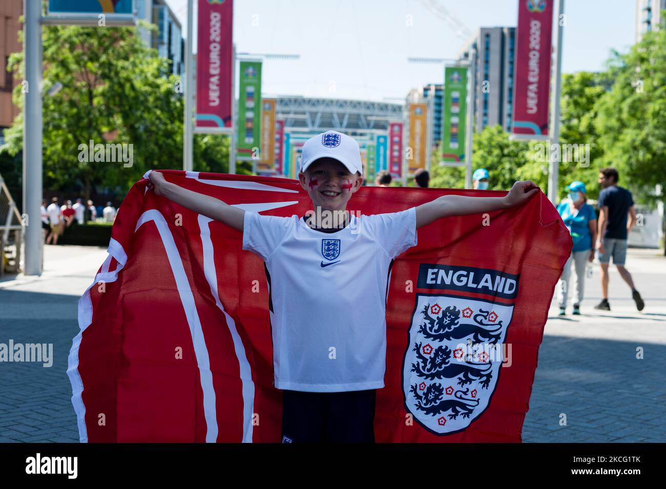 A boy, England supporter pose for a photograph as he arrives at Wembley ...