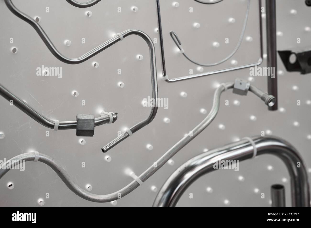 Shiny steel pipes on display in contemporary hardware store Stock Photo - Alamy
