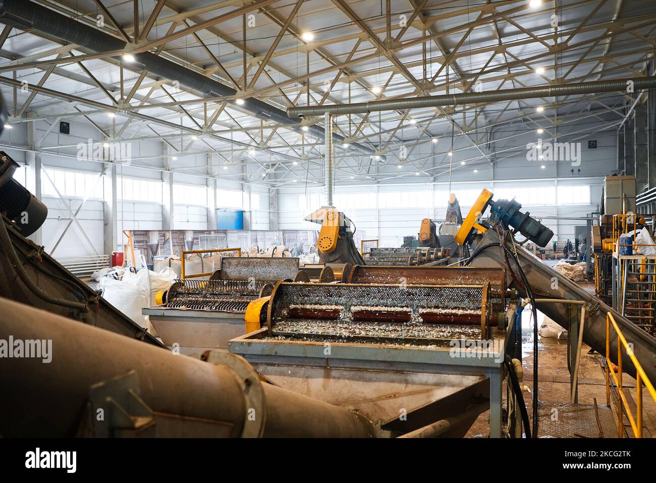Waste plastic chopping machine operates in plant workshop Stock Photo ...
