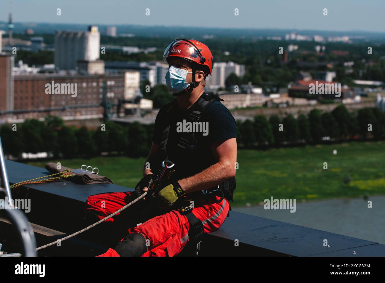 a member of the Cologne Firefighters is seen on top of Kranhaus during ...