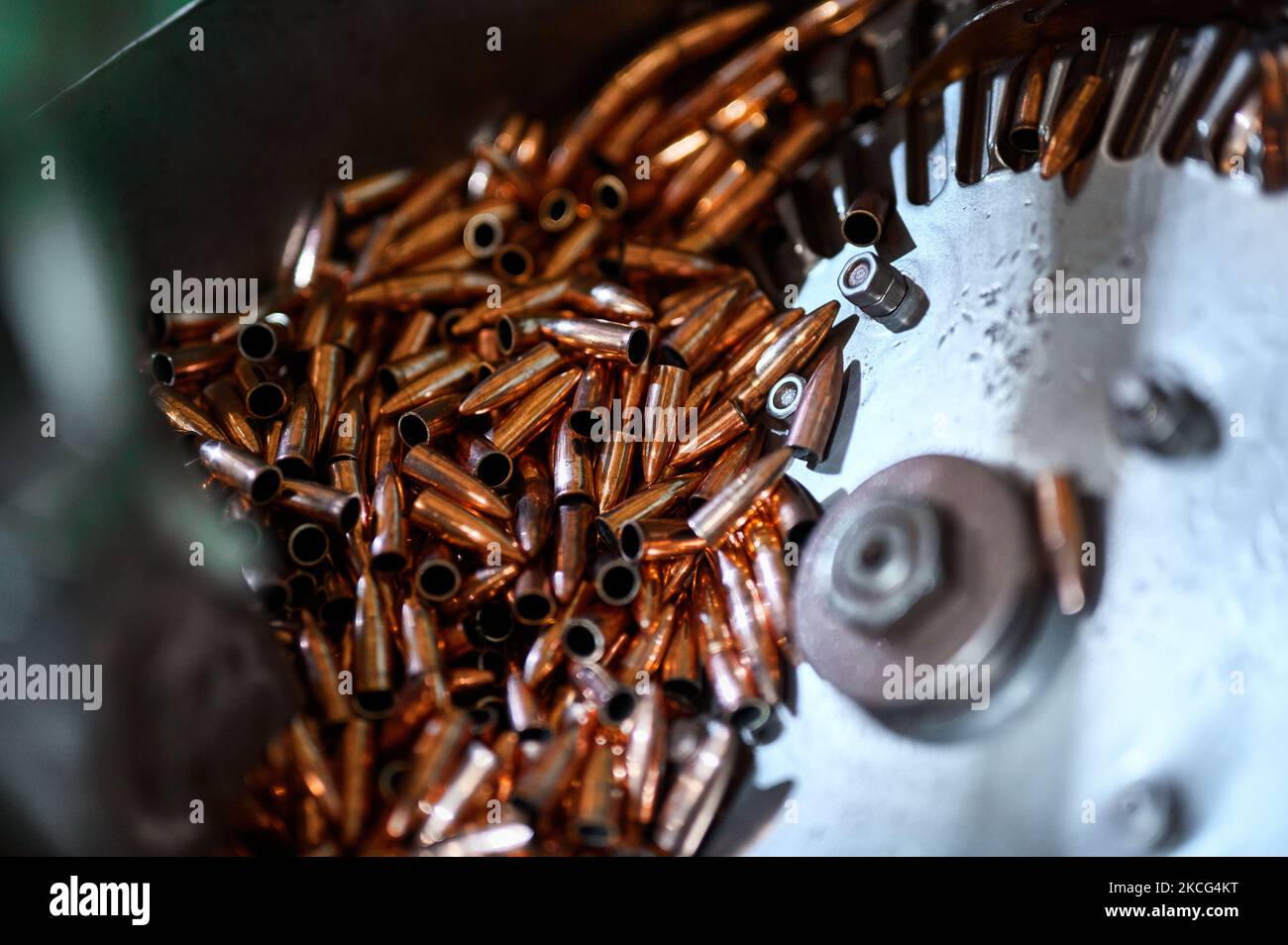 Pile of Copper bullet shells and turning wheel at production line Stock ...