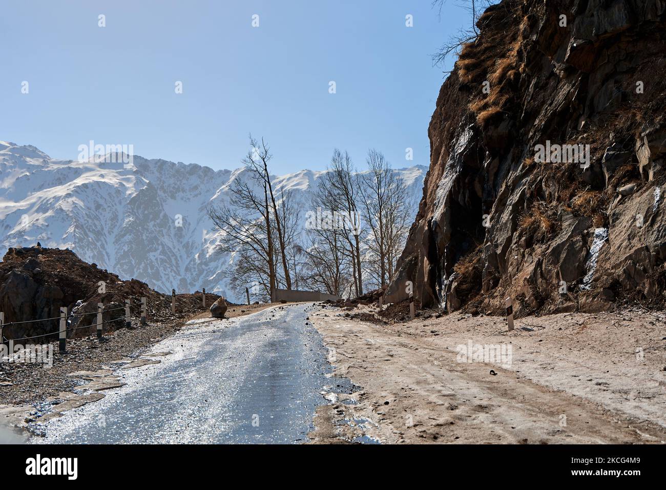 Dangerous winding road among the mountains. Mountain streamer in early ...