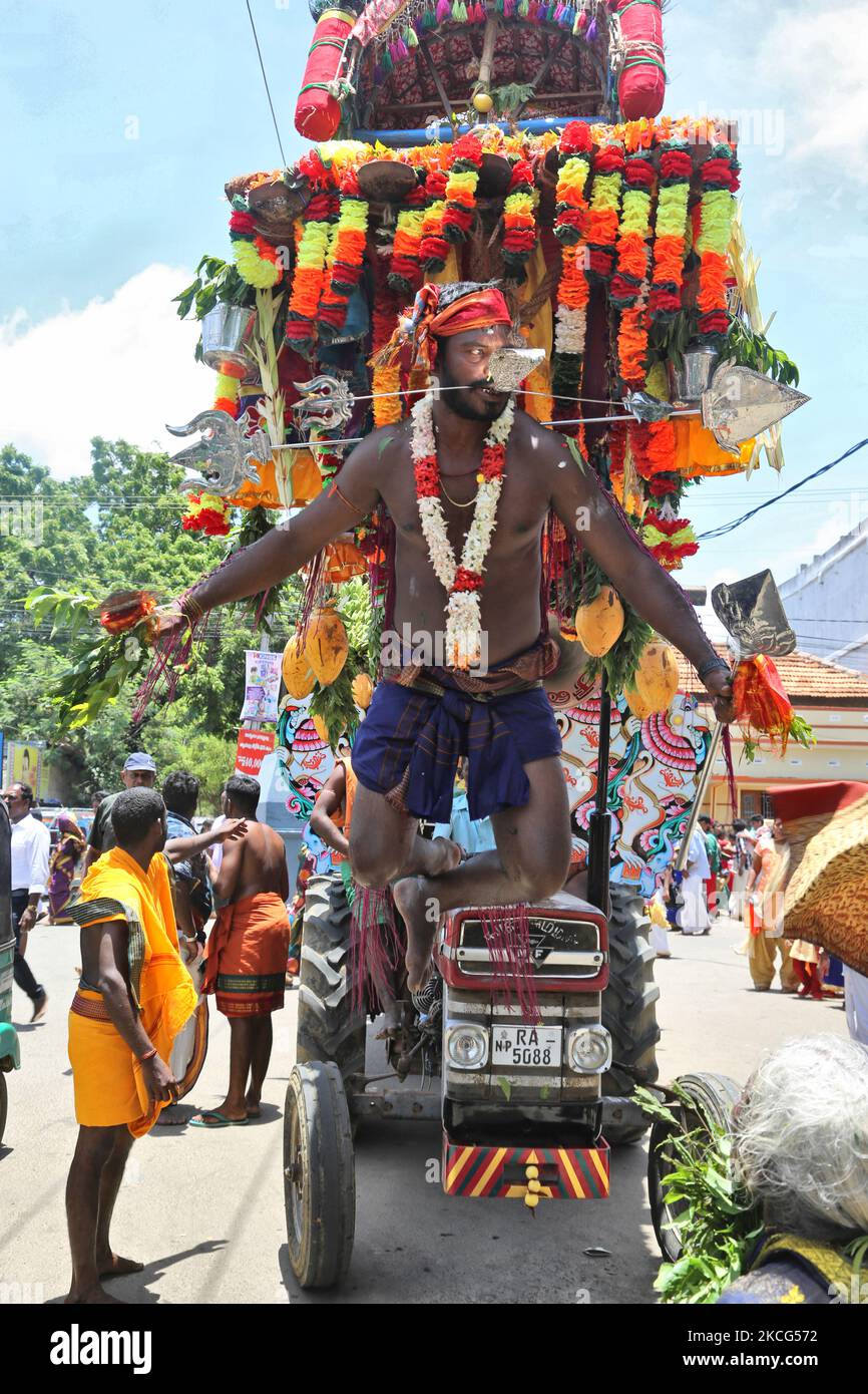 Tamil Hindu devotee performing the para-kavadi ritual (where they are ...