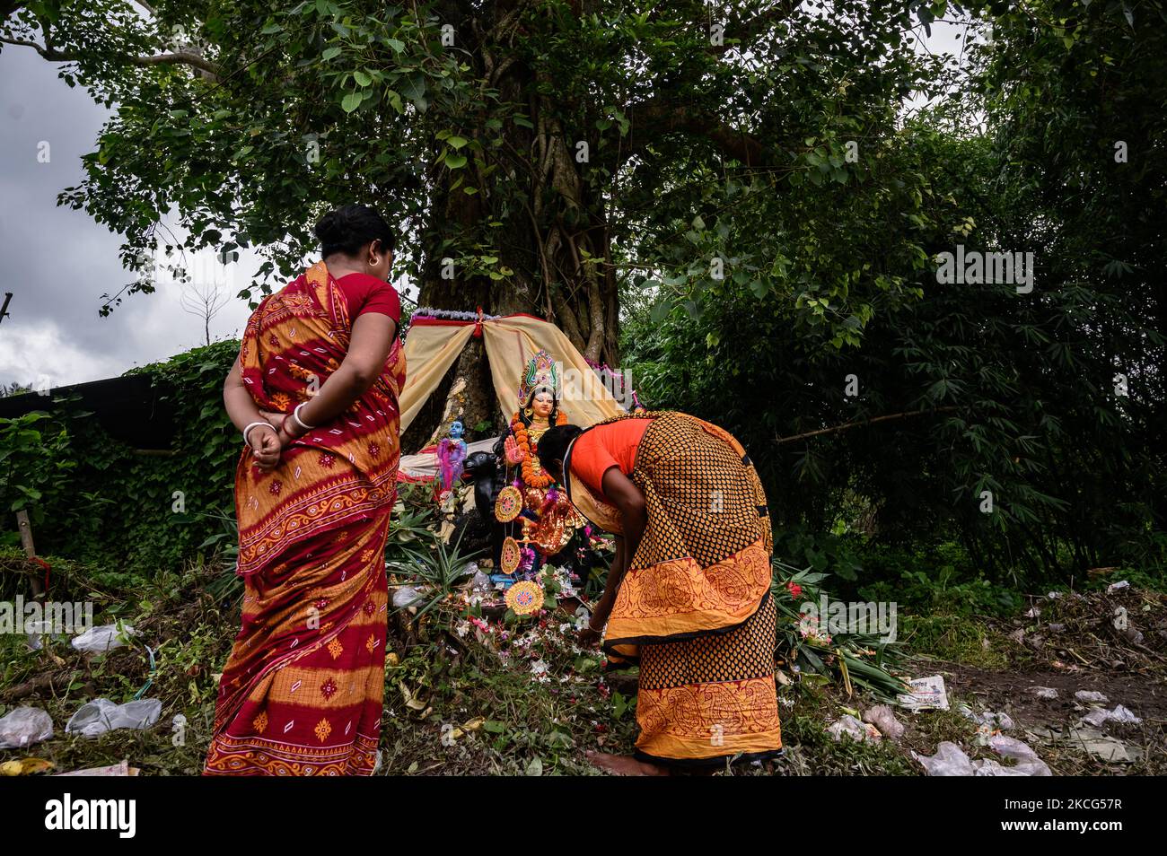 Hindu devotees attend the Bengali Hindu folk traditional festival ...