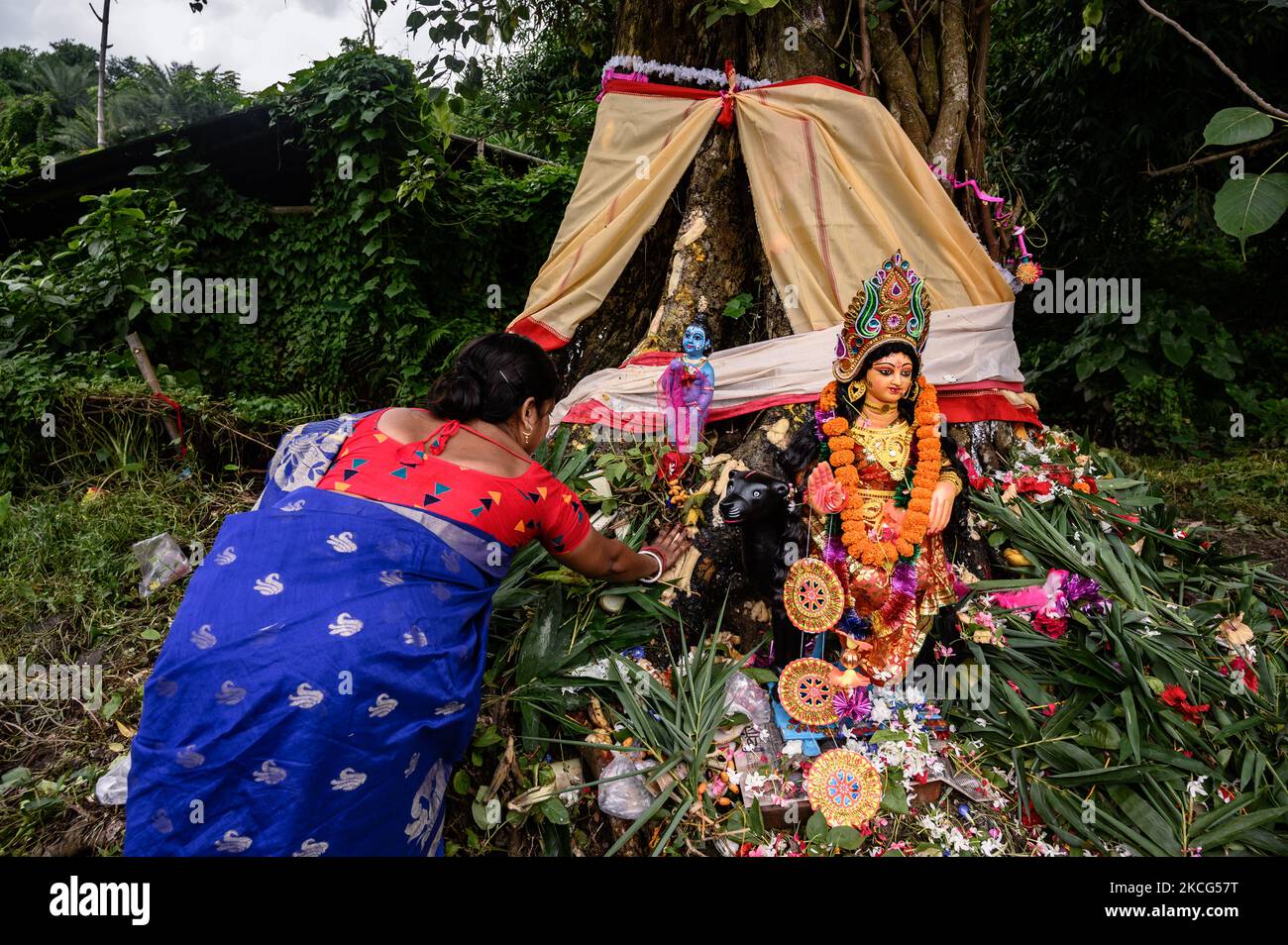 Hindu devotees attend the Bengali Hindu folk traditional festival ...