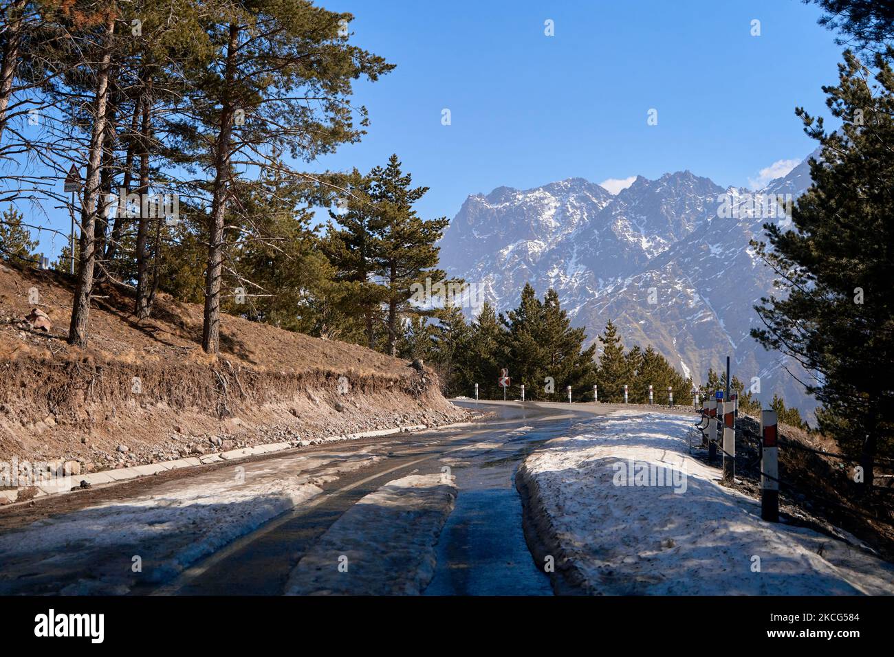 Dangerous winding road among the mountains. Mountain streamer in early ...