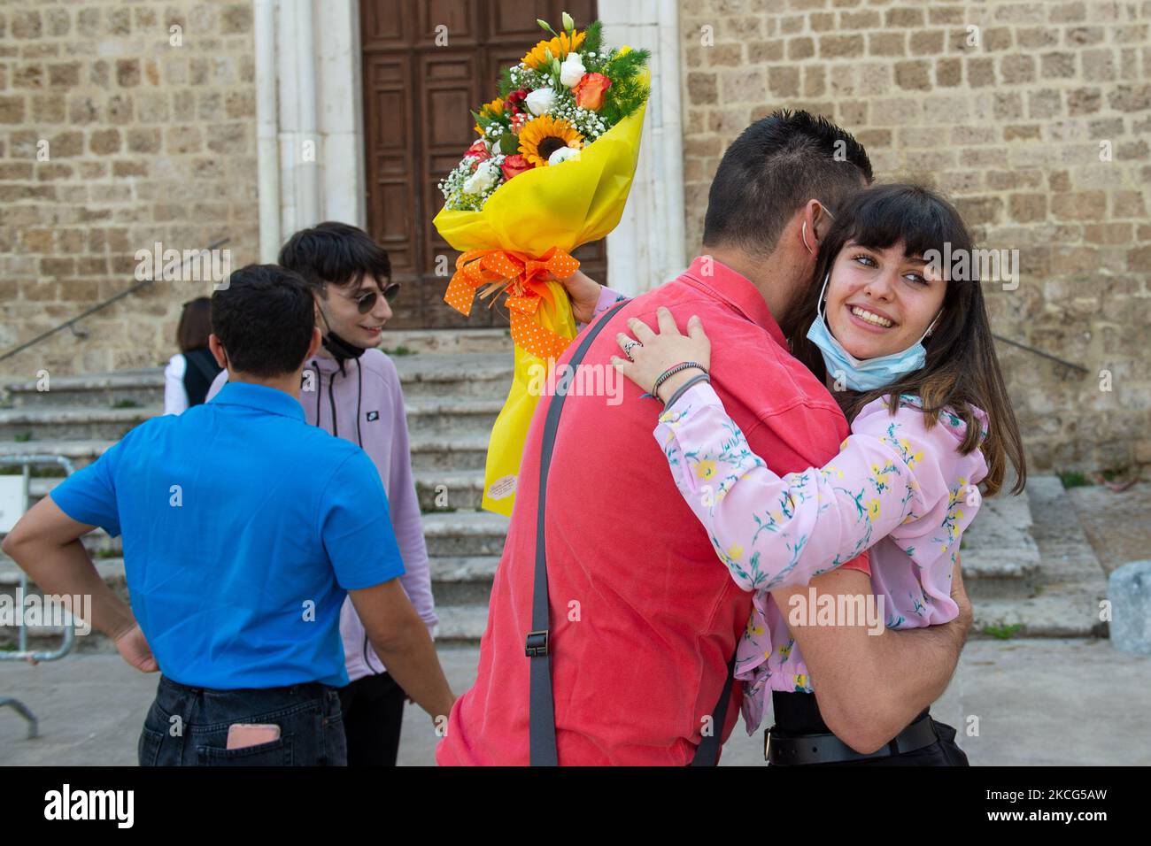 A fifth-year student embraces her father as soon as she has finished ...