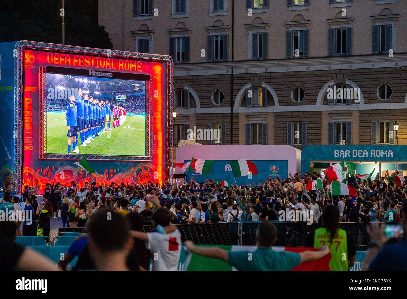 Fans sing italian national anthem and watch a live stream of the UEFA ...