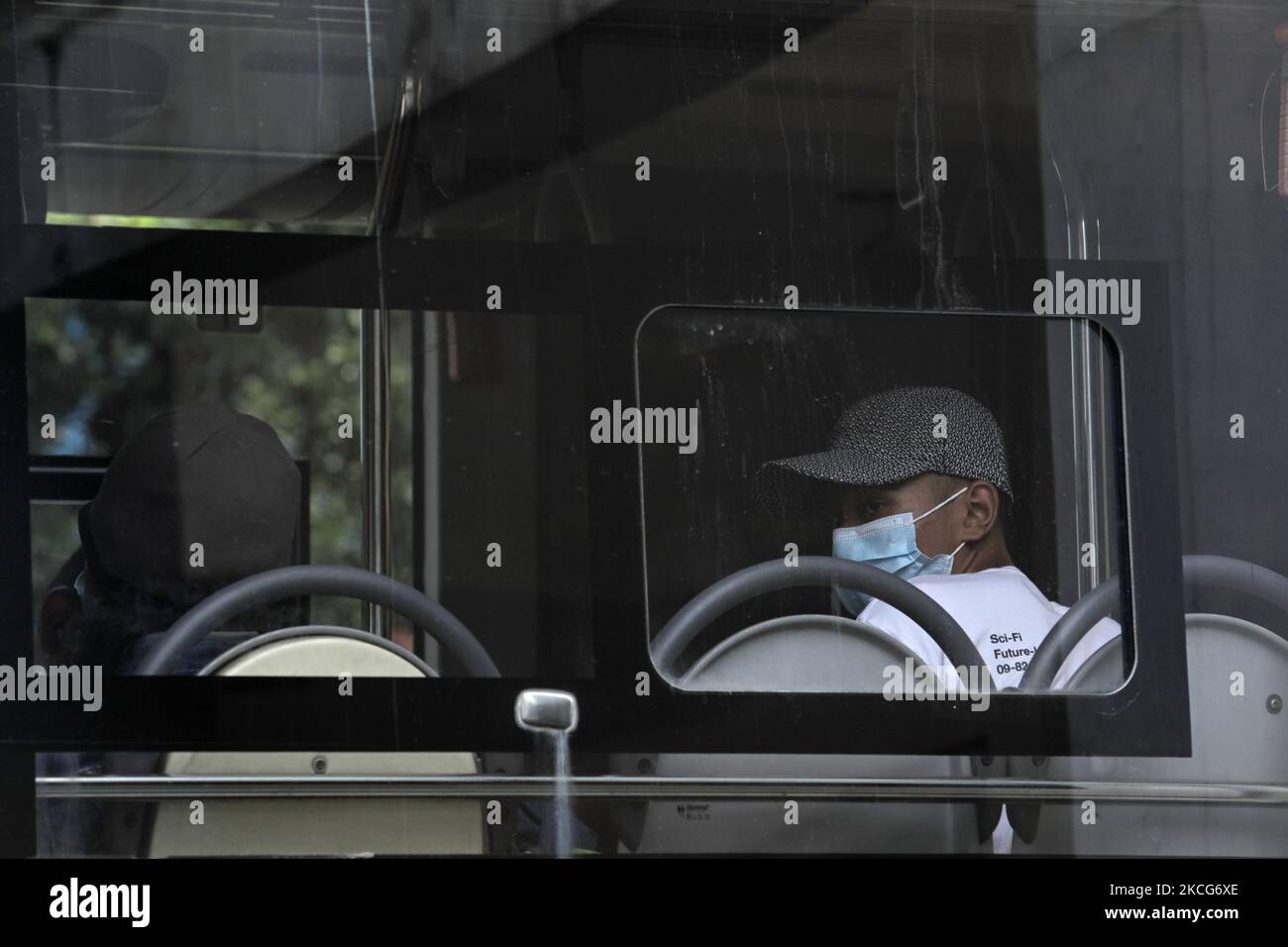 A Patient of Covid-19 sit inside a school bus assigned to transfer then ...