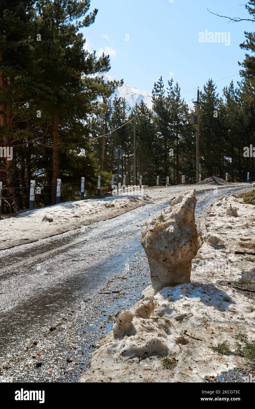 Dangerous winding road among the mountains. Mountain streamer in early ...