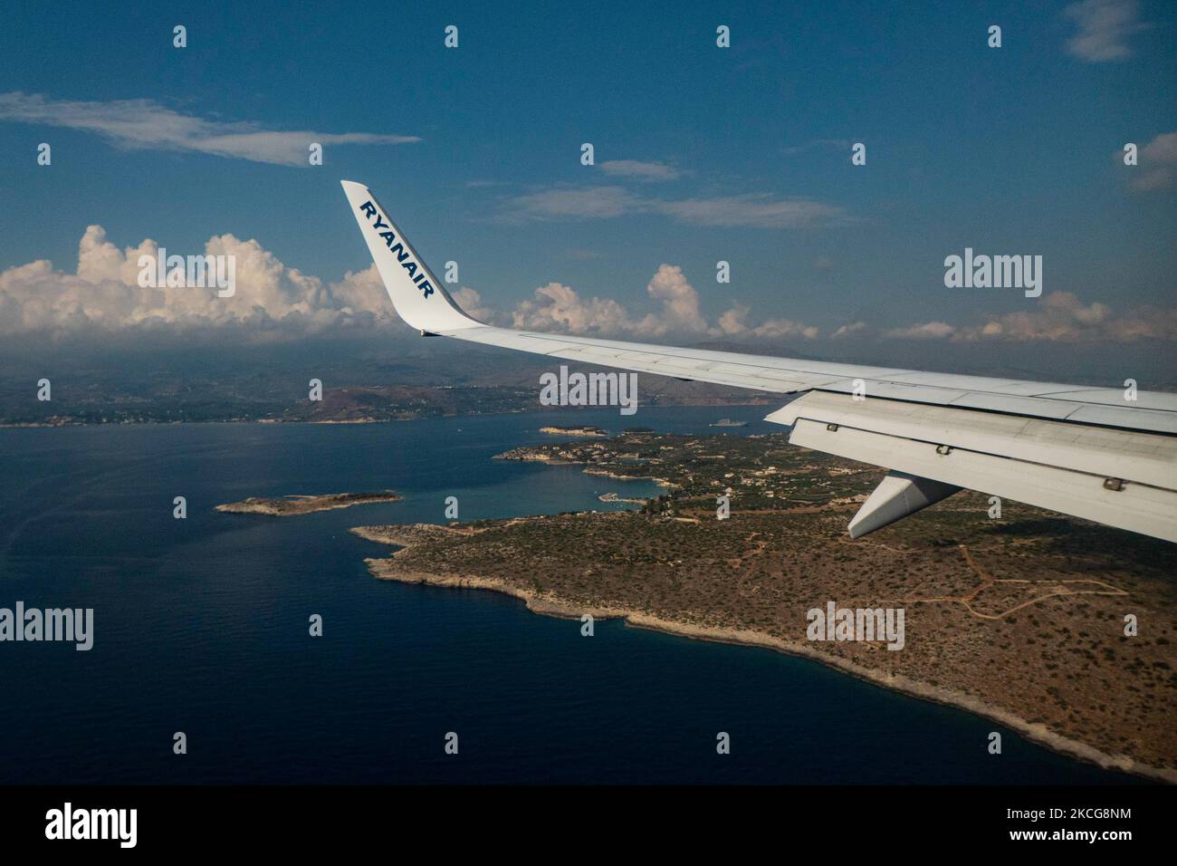 Wing view with RYANAIR logo while landing at the Mediterranean island ...