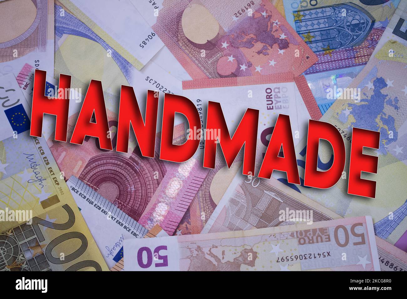 Handmade word with money. Paper currency background with different ...
