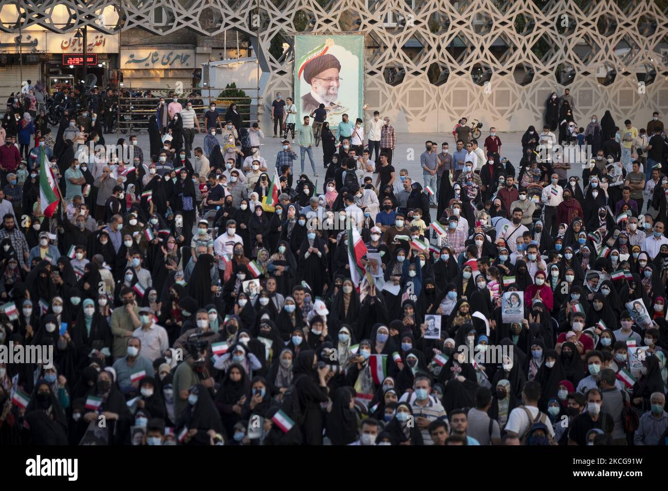 Supporters of the Iranian president elect Ebrahim Raisi attend a ...
