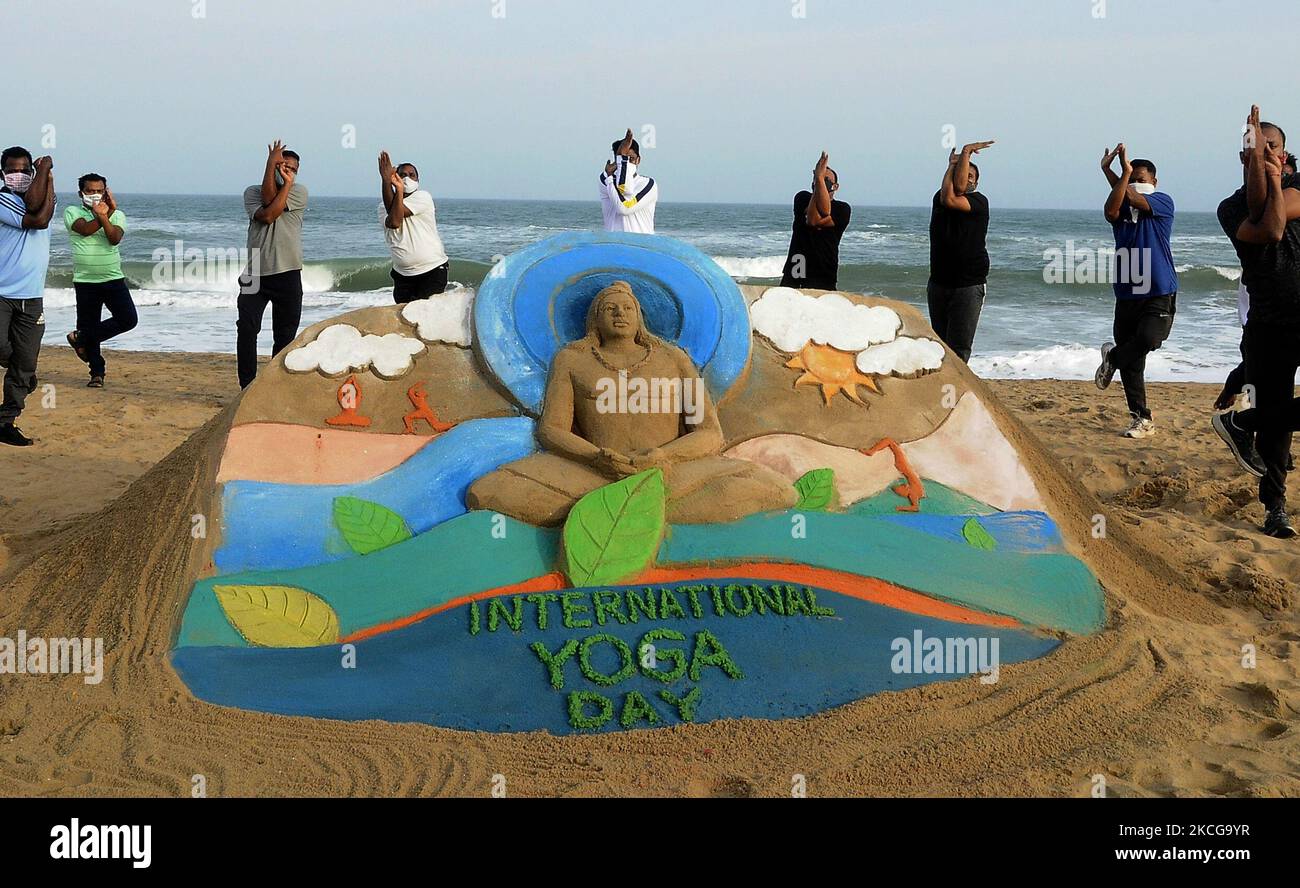 A sand sculpture is seen at the Bay of Bengal Sea's eastern coast beach ...