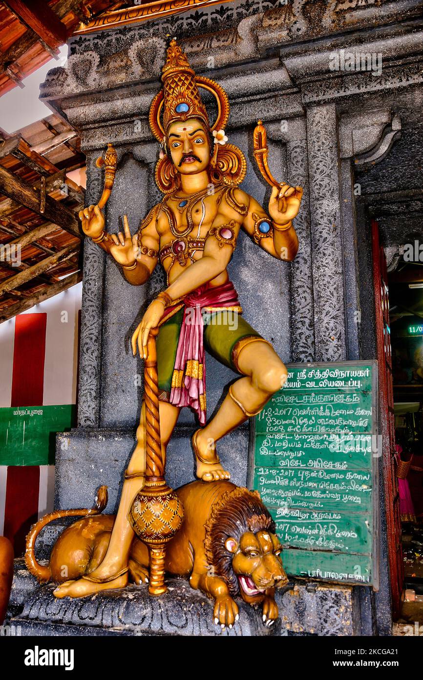 Statue of a guardian at the entrance of the at the Arasadi Vinayagar ...