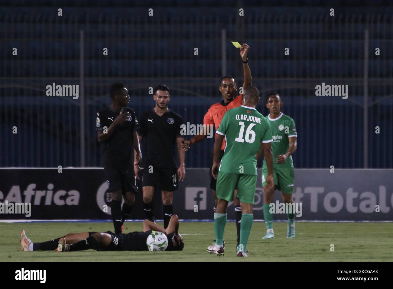 Referee show yellow card to Morocco's Omar Arjoune during CAF ...
