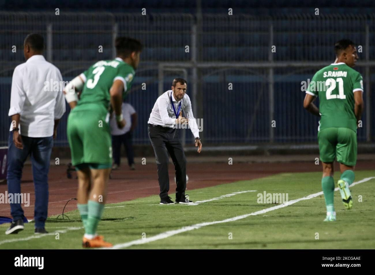 Soufiane Rahimi (R) of Raja runs and former Argentine footballer ...