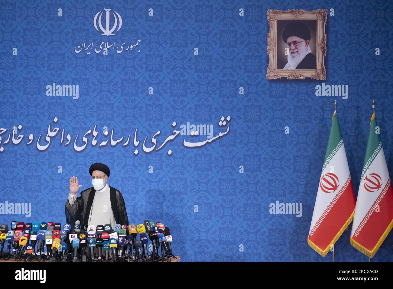 Iranian President elect Ebrahim Raisi waves to media as he arrives a ...