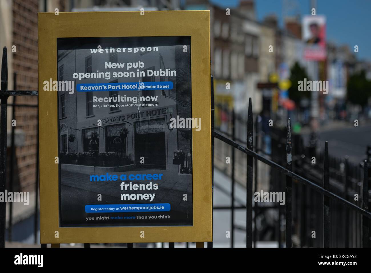 A board announcing the opening of Wetherspoon, a new pub and hotel in ...