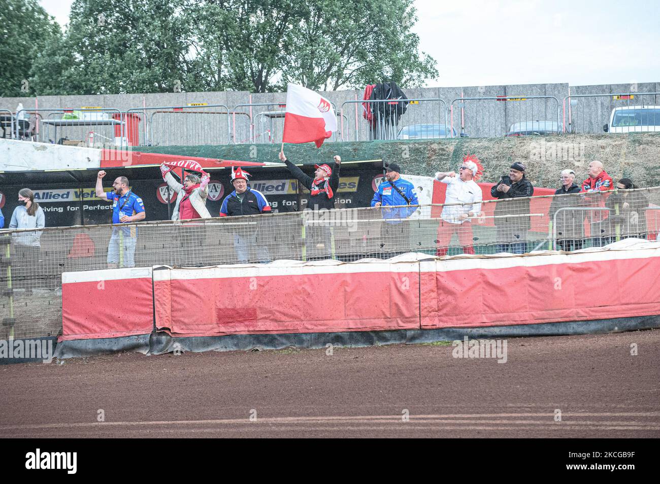 Polish fans cheer on Musielak as he leads his final heat during the FIM ...
