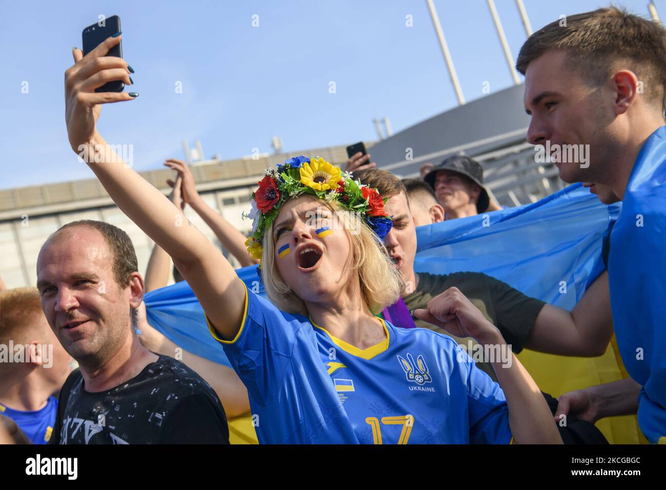 Ukrainian soccer fans cheer at the Fan Zone in downtown Kyiv, Ukraine ...