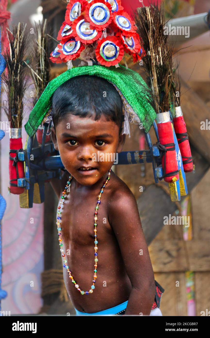 Tamil Hindu boy performs the kavadi attam ritual while circling the ...