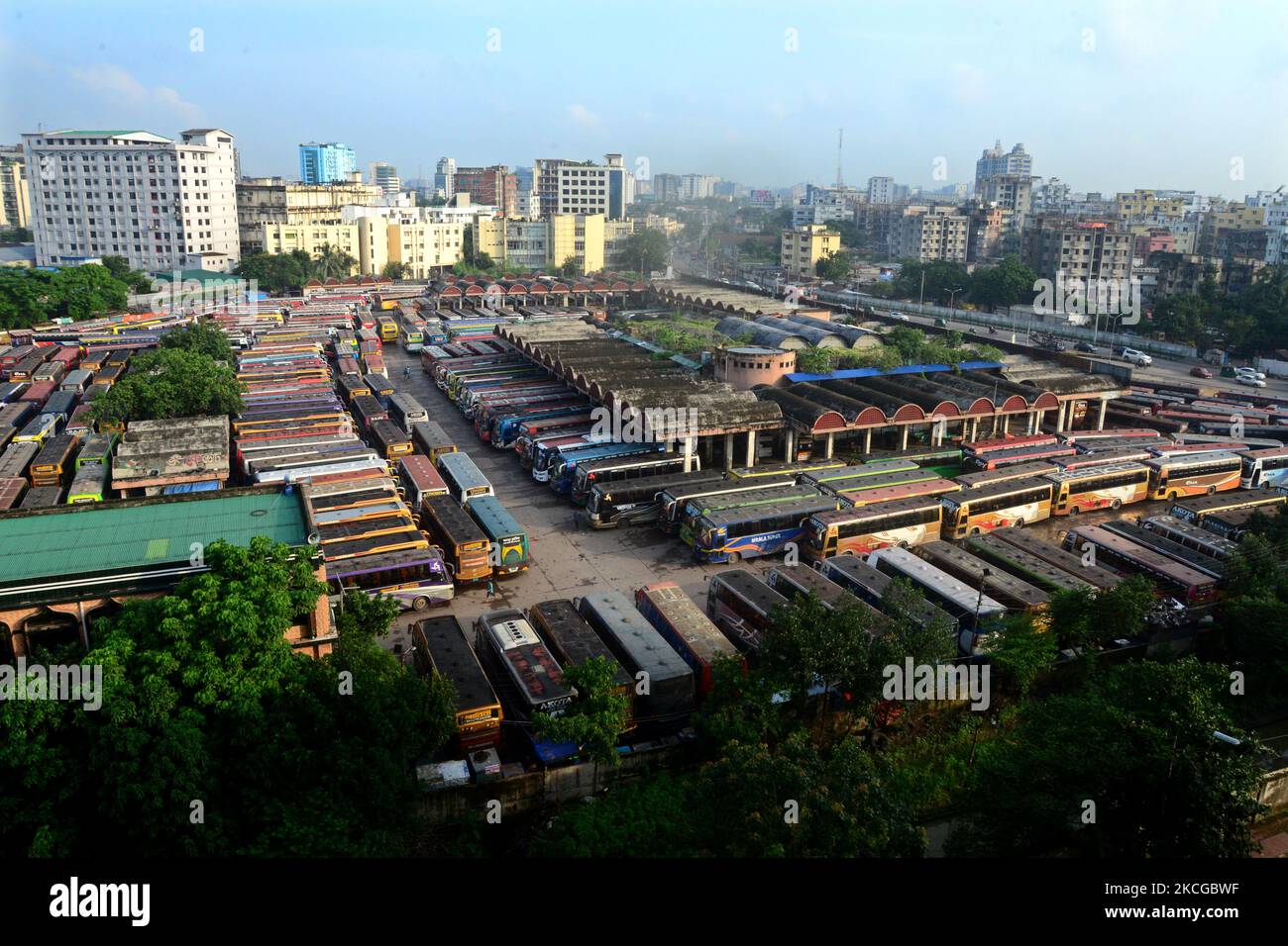 Buses can be seen parked inside a inter district bus terminal Burning ...