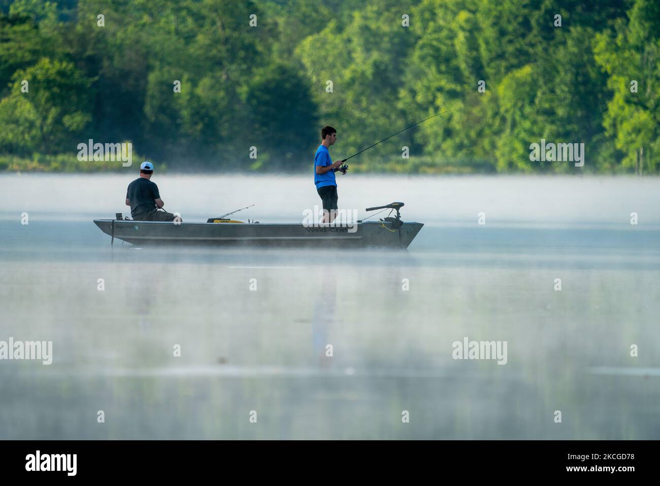 Fishermen are seen at Miami Whitewater Forest Park during the early ...