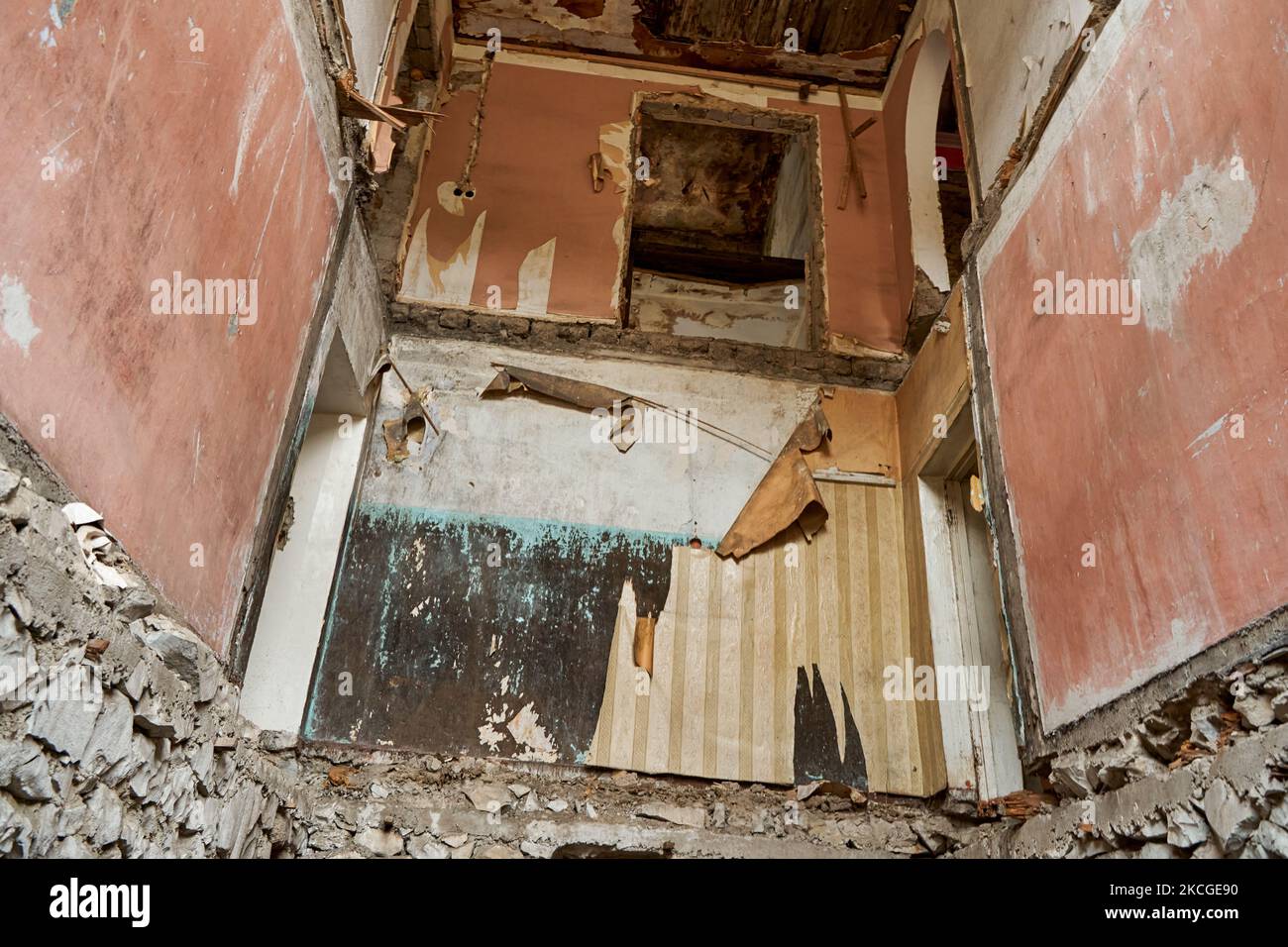 The interior of an abandoned crumbling building. A dying city ...