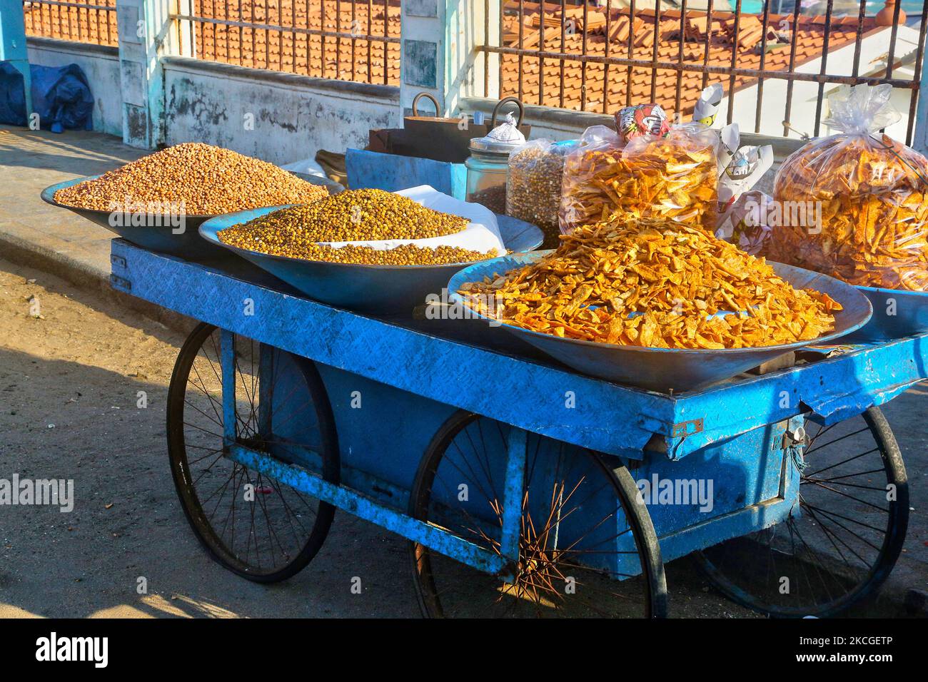 Food sellers sell snacks on small carts along the roadside in ...