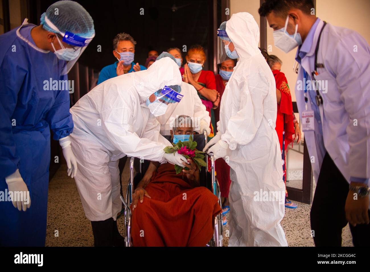 Health workers donned in Personal protective equipment (PPE) bid ...