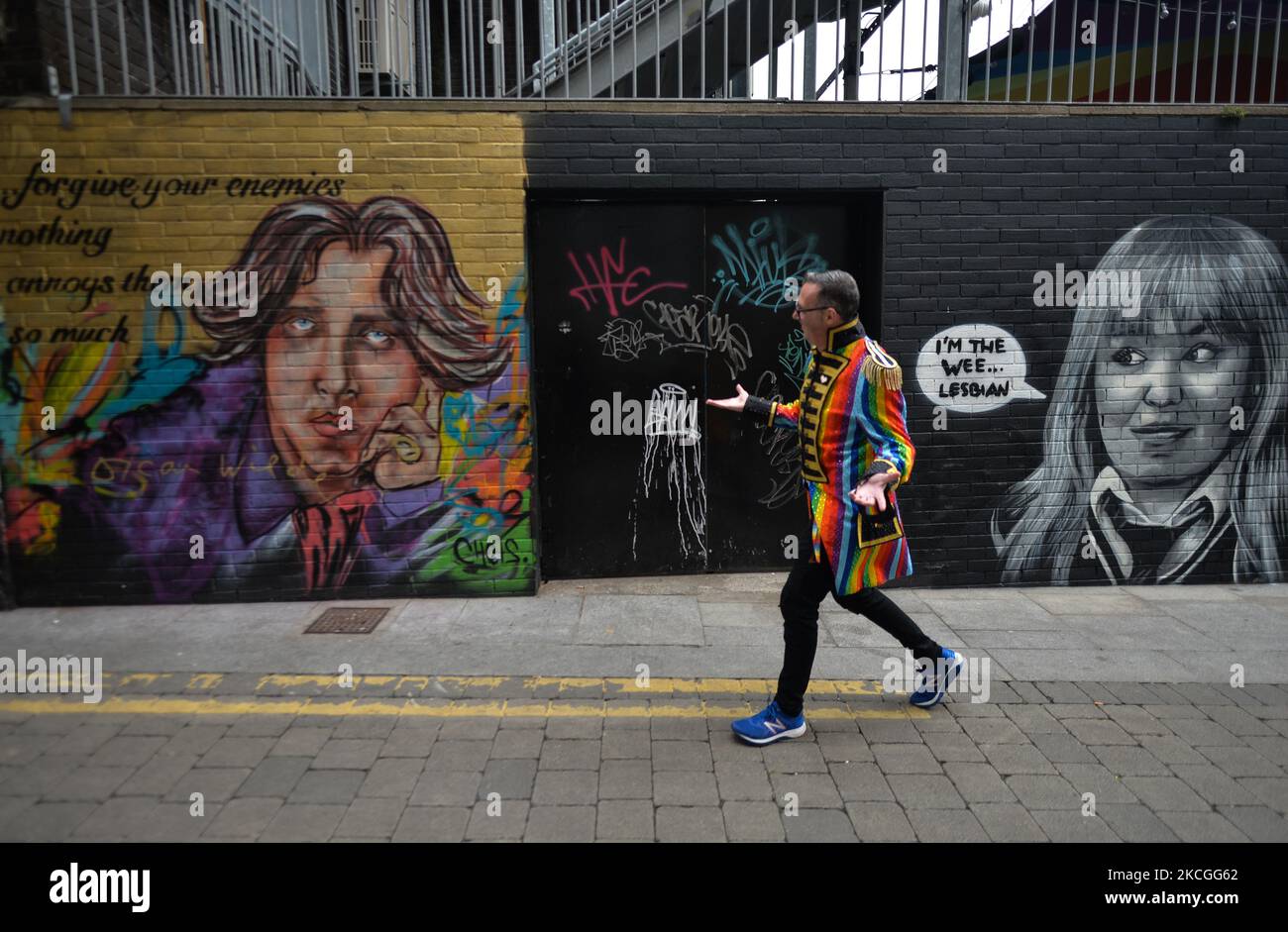 Eddie McGuinness, Dublin Pride Head of Events walks past a new mural ...