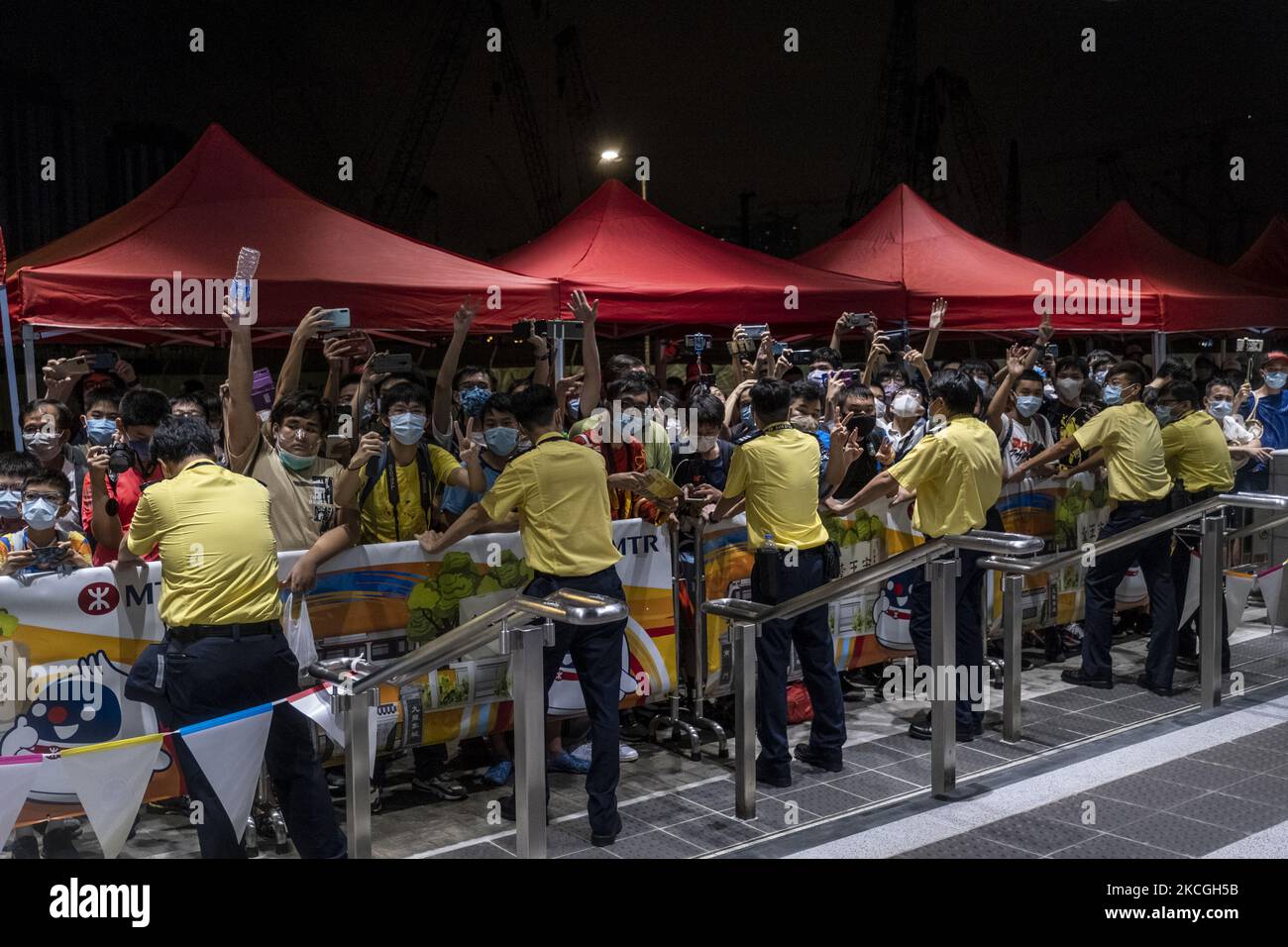 Passengers line up outside Sung Wong Toi Station in Hong Kong, Sunday ...
