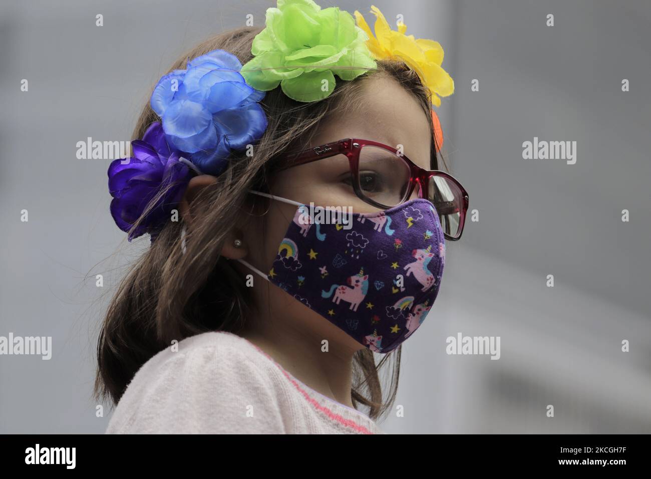 A girl carries a crown of the LGBTTTIQA community in front of the Angel ...