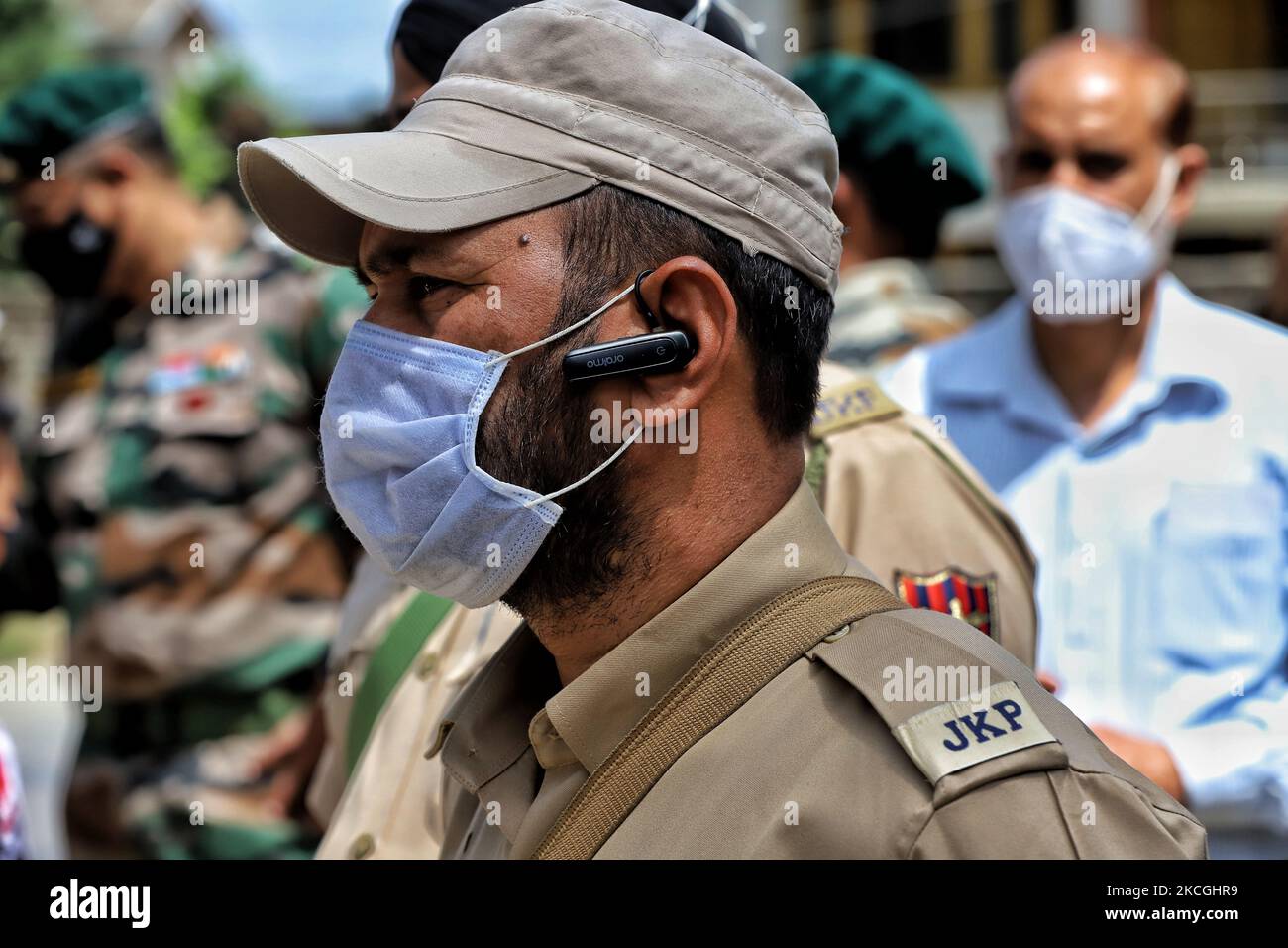 A JKP Jammu and Kashmir Police Cop wearing a mask during Indian Army's ...
