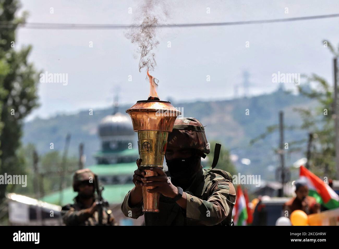 An Indian Army Soldier holds the Mashaal in Baramulla, Jammu and ...