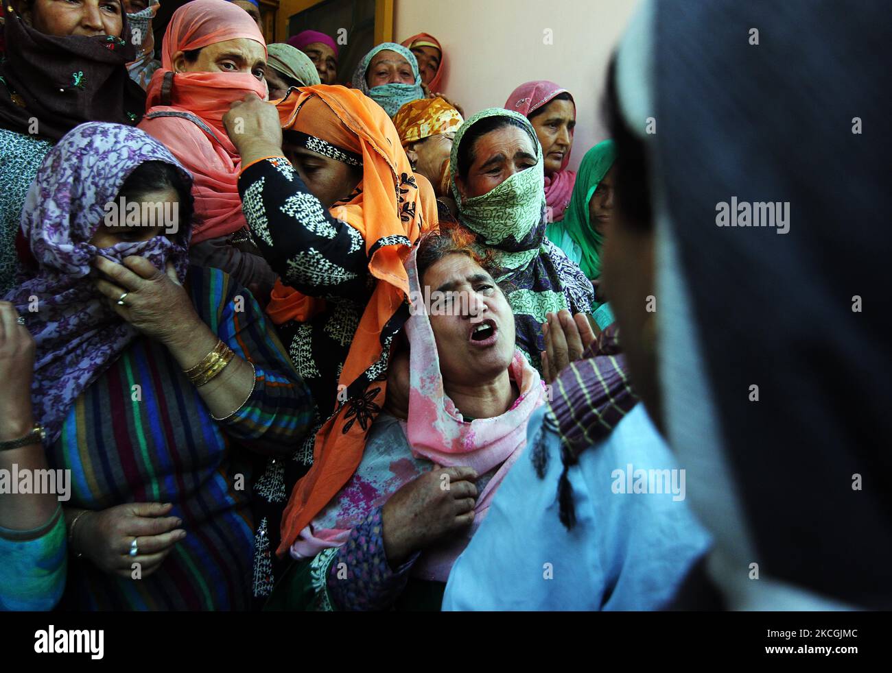 A woman mourns the death of 25 year old Rafia Jan during the funeral ...