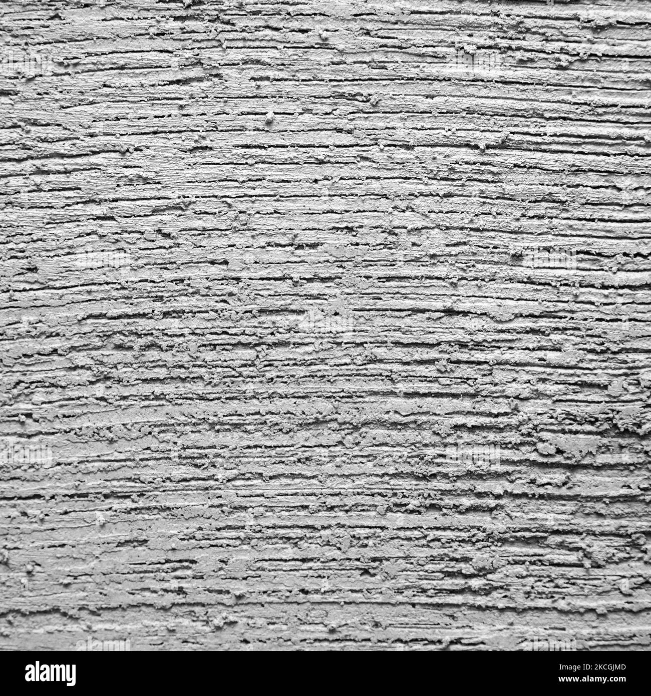 Gray decorative plaster on the wall with pressed horizontal stripes ...