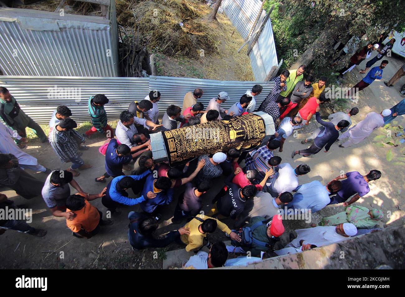 People carry the coffin containing the dead body of 25 year old Rafia ...