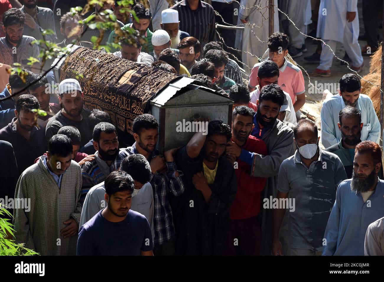 People carry the coffin containing the dead body of 25 year old Rafia ...