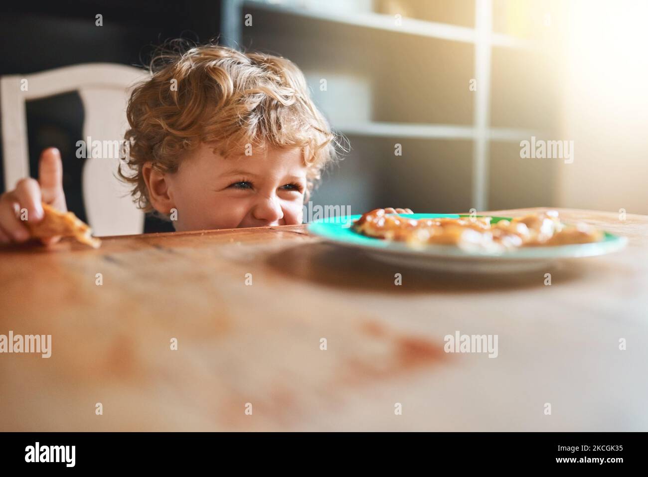 Do I have to eat now I want to play. an adorable little boy eating at ...