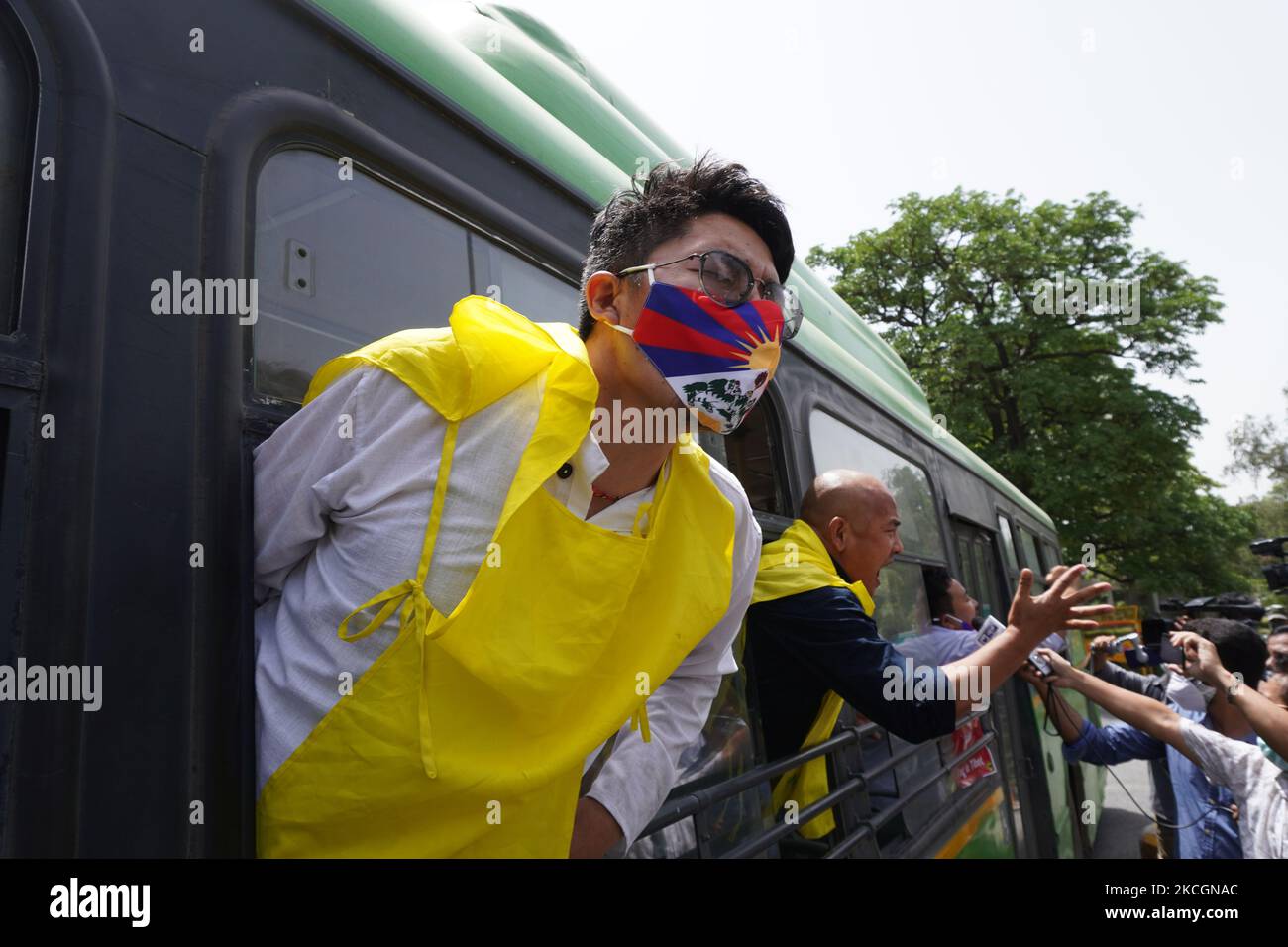 Activists of the Tibetan Youth Congress shout slogans after being ...